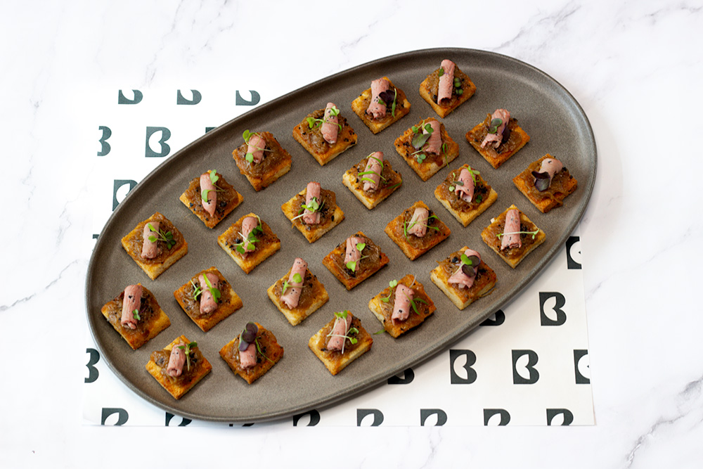 Shaved Duck Breast & Onion Jam on Garlic Croute